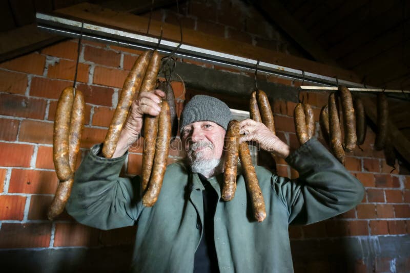 Old man with dry sausages stock photo. Image of broke - 91540870