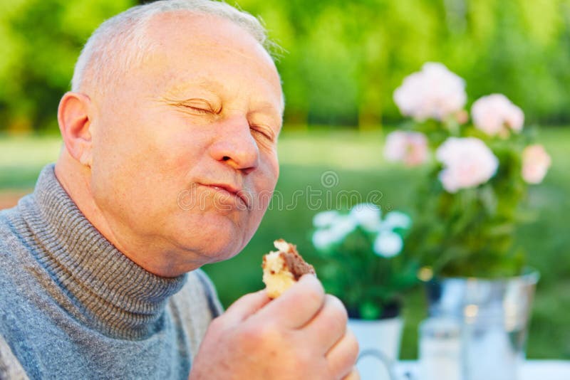 Old Man Eating Cake in Garden Stock Photo - Image of birthday, summer ...