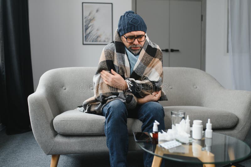 Old Man Get a Cold and Sneeze with Tissue Paper at Home Stock Photo ...
