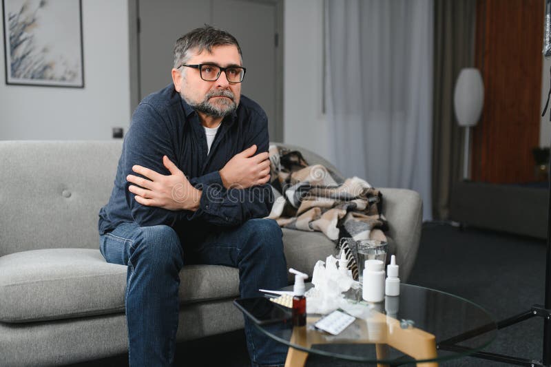 Old Man Get a Cold and Sneeze with Tissue Paper at Home Stock Photo ...