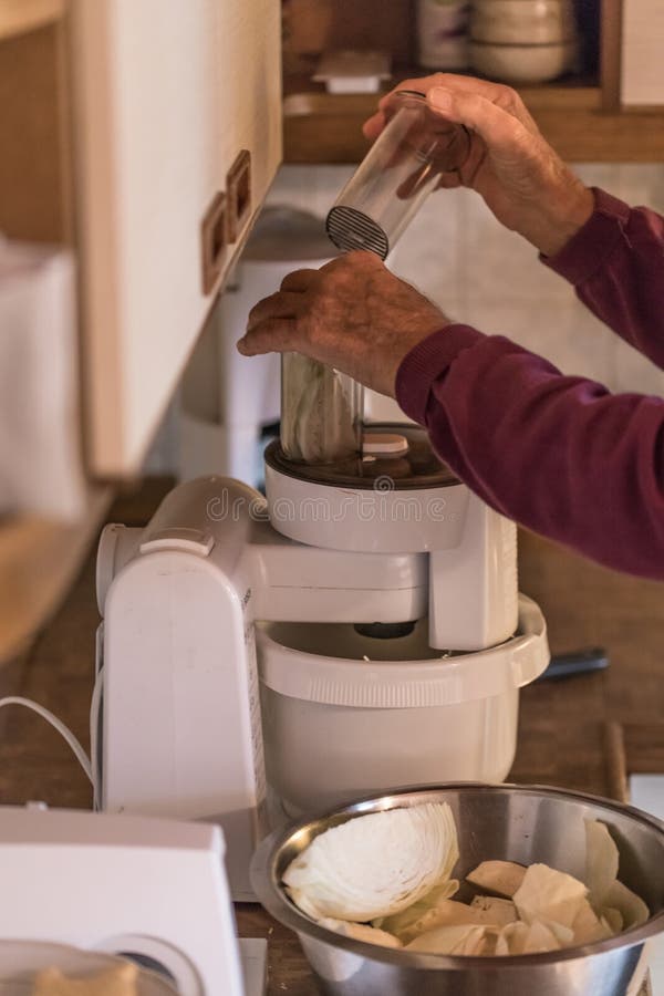 Old Man Grandpa with Hands Uses a Kitchen Ash and Chops White Cabbage ...