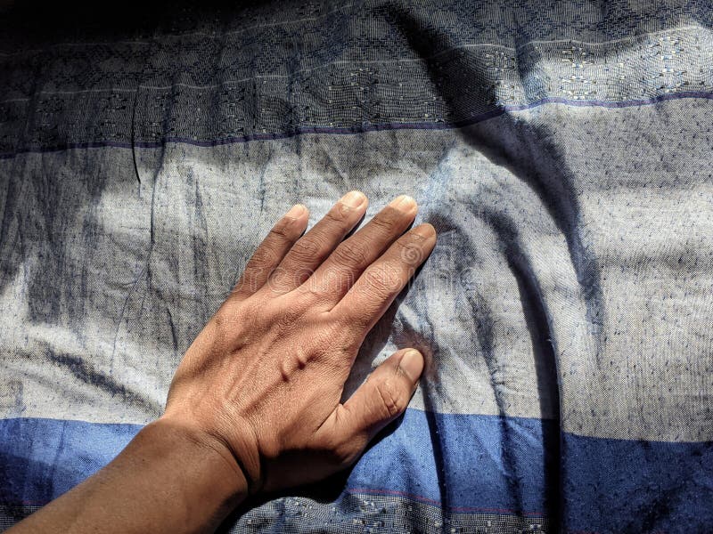 Old Man Hand on Blue Cloth with Beautiful Pattern Stock Photo - Image ...