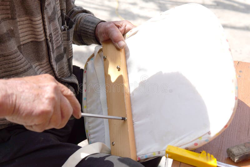 Old Man Hands Fixing Broken Chair with Screwdriver Stock Image - Image ...