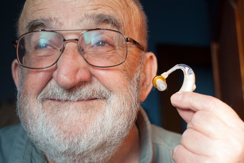 Old man with hearing aid stock image. Image of illness - 74172859