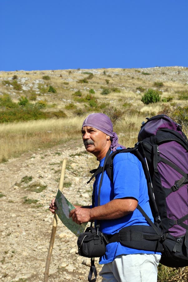 Old man hiking stock image. Image of cliffs, boots, clouds - 21388457