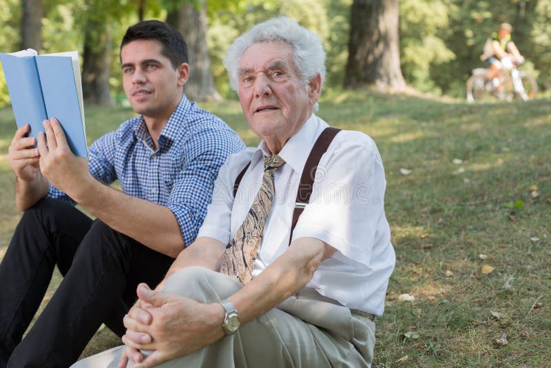 Old man and his grandson stock image. Image of senescence - 59011001
