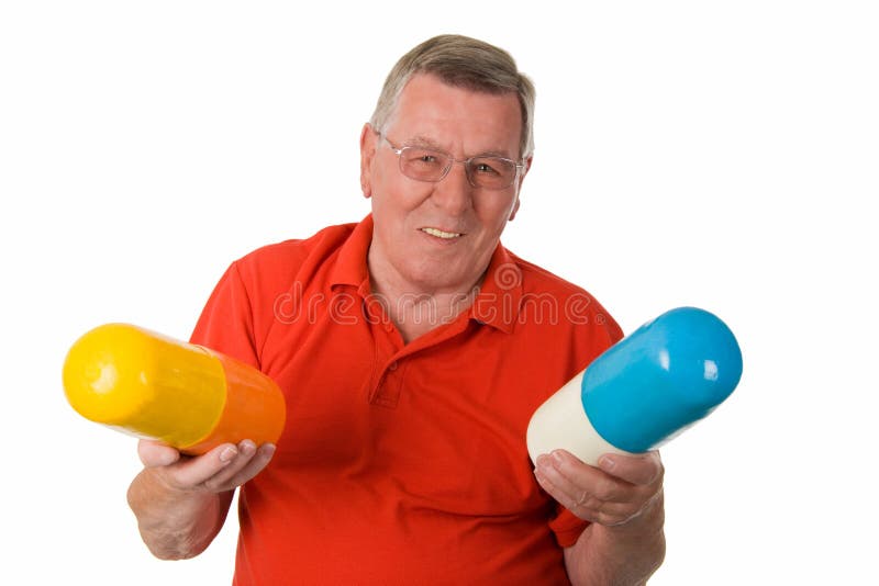 Old man holding big pills stock photo. Image of isolated - 28068276
