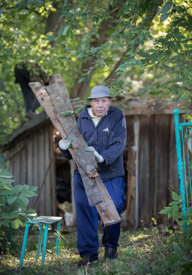 Tatarstan, Russia - 25 August 2018 - Old Man Holding Boards in Forest ...