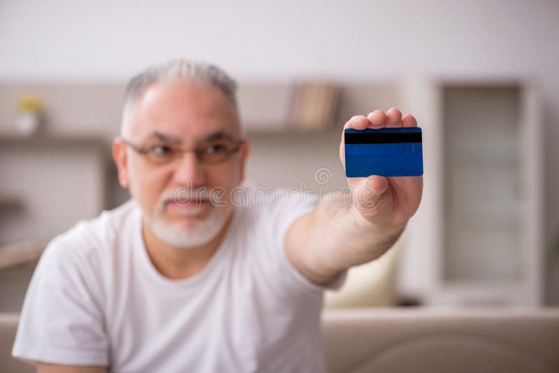 Old Man Holding Credit Card Stock Photo - Image of card, demonstrating ...