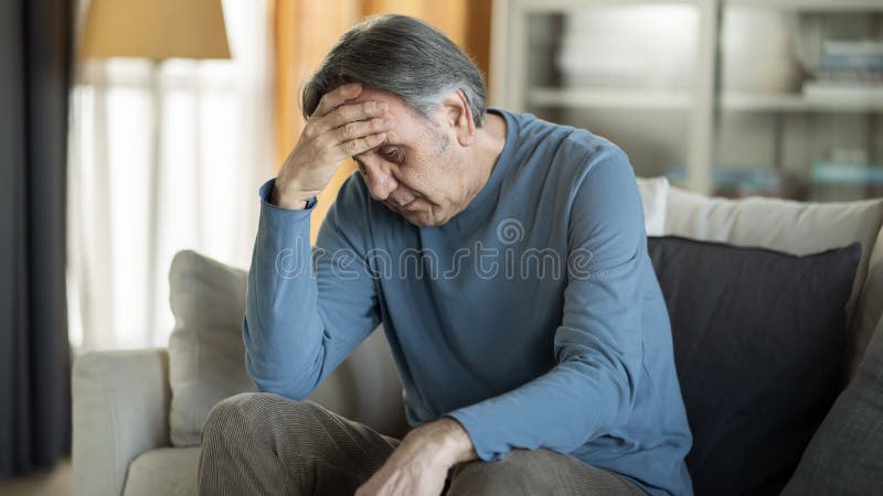 Old Man Holding His Forehead Sitting Alone at Home Stock Photo - Image ...