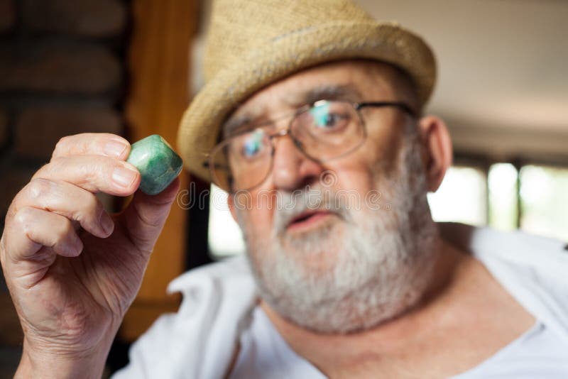 Old Man Inspecting a Precious Stone Stock Photo - Image of fingers ...