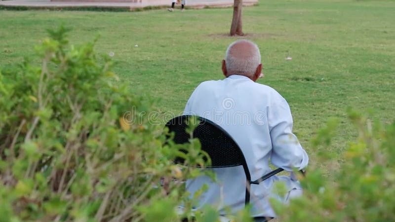 Old Man Isolated Sitting Alone at Iron Chair at Park from Back at ...