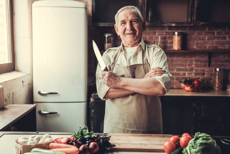 Old man in kitchen stock image. Image of casual, pepper - 97136685