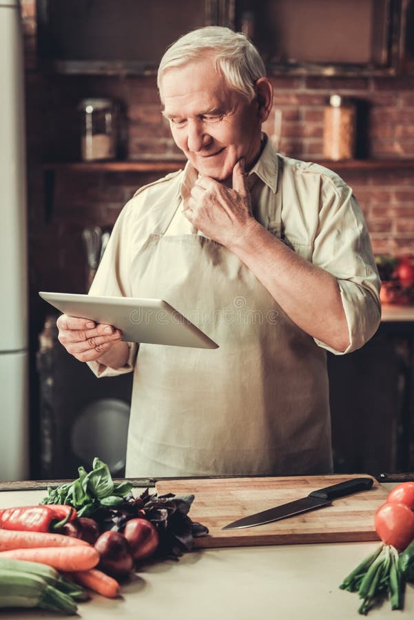 Old man in kitchen stock photo. Image of knife, happy - 97136358