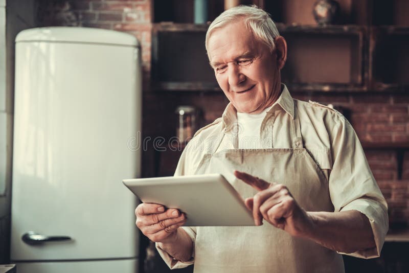 Old man in kitchen stock photo. Image of adult, knife - 97136368