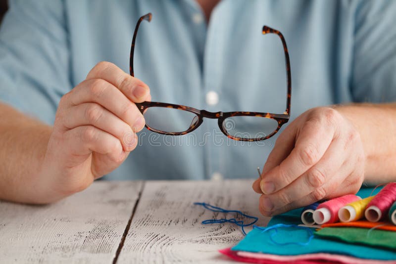 Man Threading Needle Stock Photos - Download 70 Royalty Free Photos