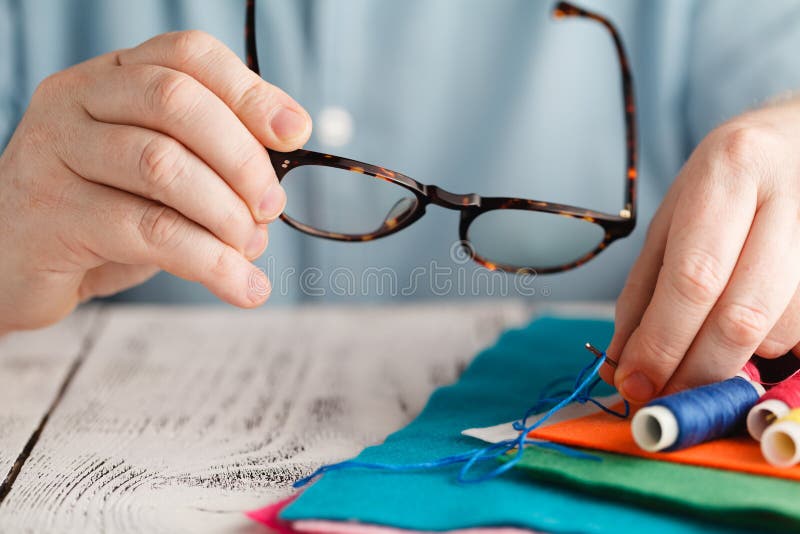 Man Threading Needle Stock Photos - Download 70 Royalty Free Photos