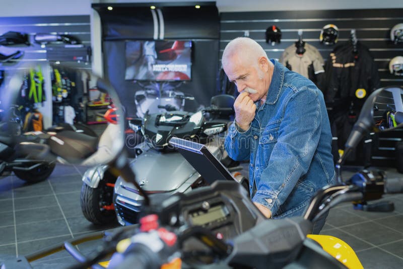 Old Man Looking for Vehicle in Store Stock Image - Image of elderly ...