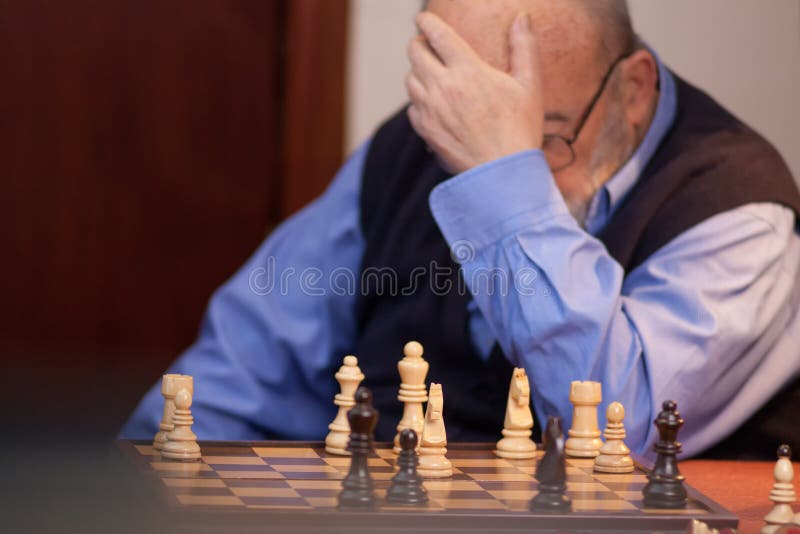 Old man losing chess match stock image. Image of adult - 87444923