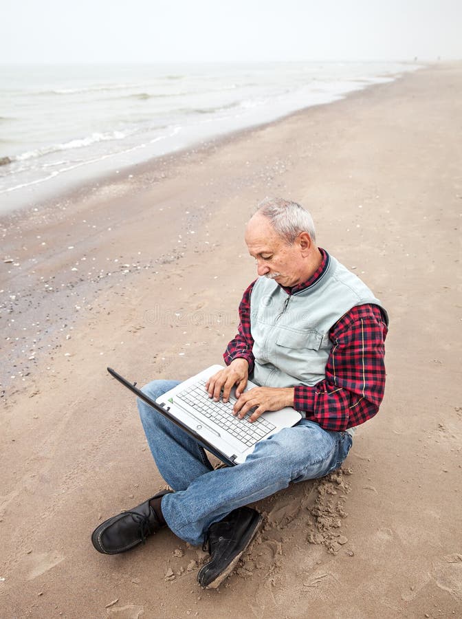 Old Man with Notebook on Beach Stock Photo - Image of chat, chatting ...