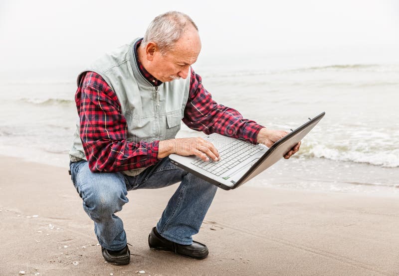 Old Man with Notebook on Beach Stock Photo - Image of laptop ...