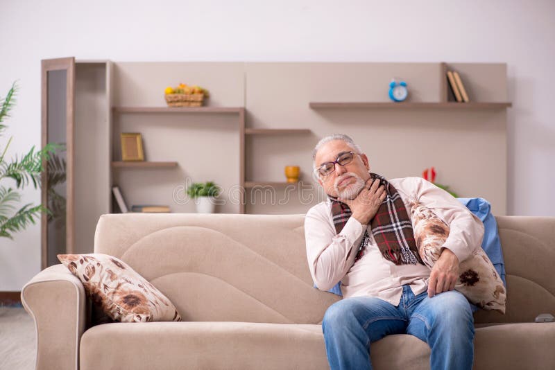 Old man suffering at home stock photo. Image of cold - 233585330