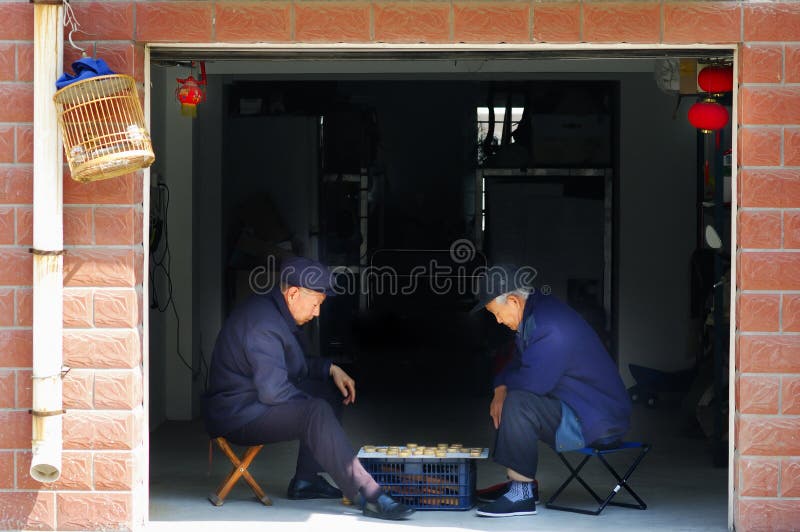 Old man play Chinese Chess stock image. Image of active - 4894167