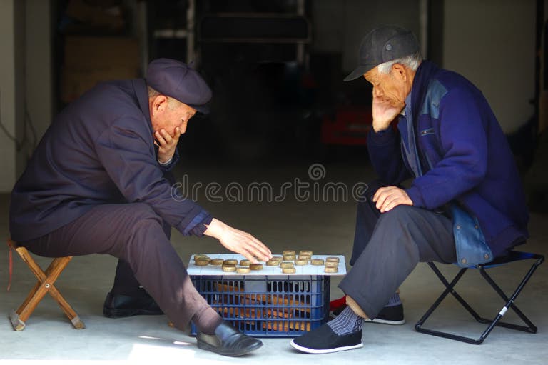 Old man play Chinese Chess stock image. Image of game - 4894179