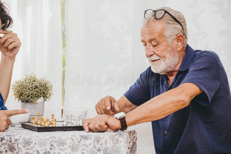 Old Man Playing Chess Board Game at Home for Training Brain Memory and ...
