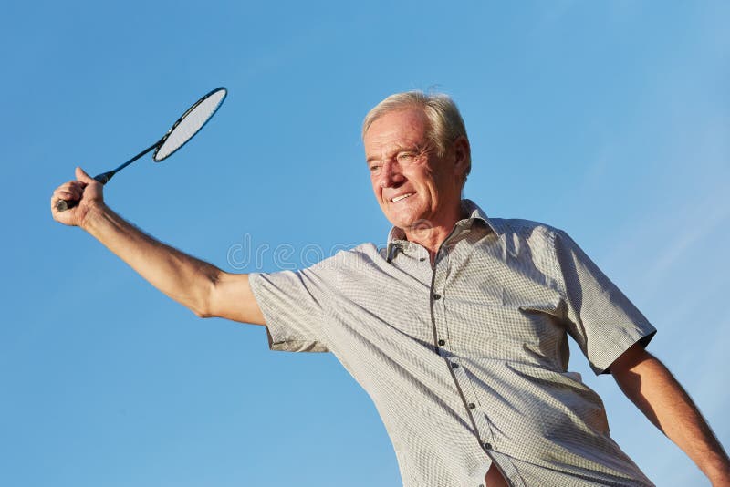 Old man plays badminton stock photo. Image of citizen - 92904668