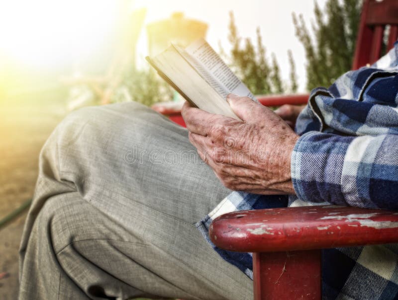 Old man reading book stock image. Image of holding, close - 67944081