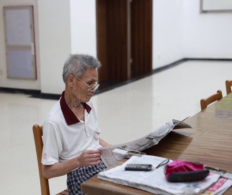 Old Man Reading Newspaper in Library Editorial Photography - Image of ...
