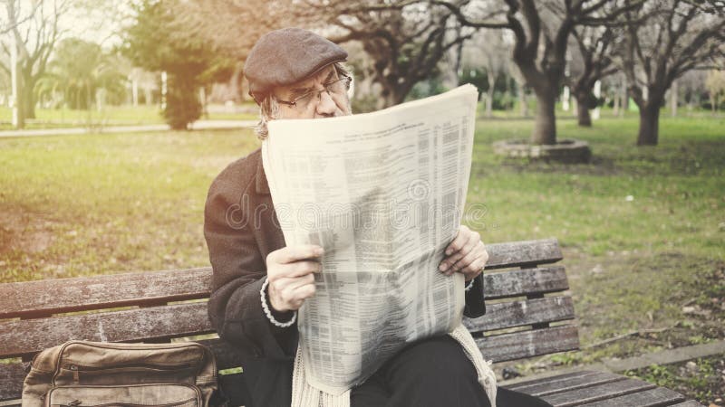 Old Man Reading Newspaper in the Park Stock Image - Image of retired ...