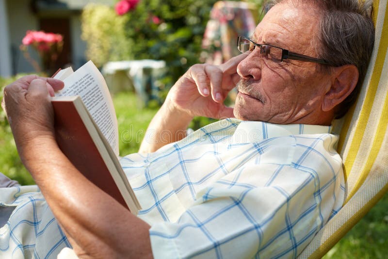 Old man reading outdoor stock image. Image of american - 8503263