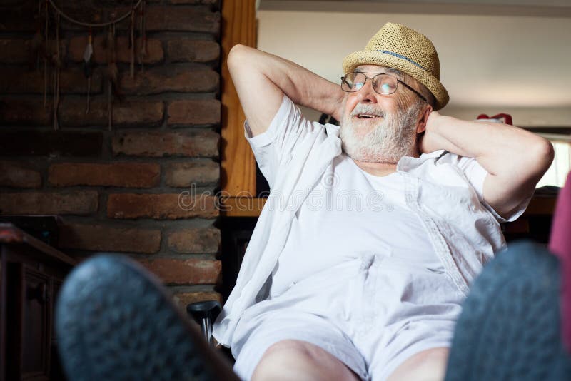 Old man resting in a chair stock image. Image of beard - 74172889