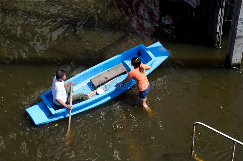 The Old Man Rowing a Boat To Help Flood Victims Editorial Image - Image ...