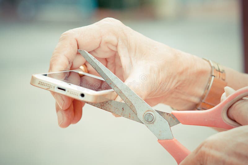 The Old Man S Hand Holding Scissors and Cut Mobile Phone Stock Image ...
