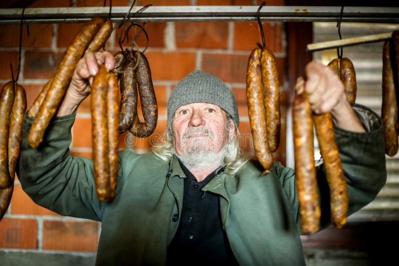 Old man with sausages stock image. Image of indigent - 91540885
