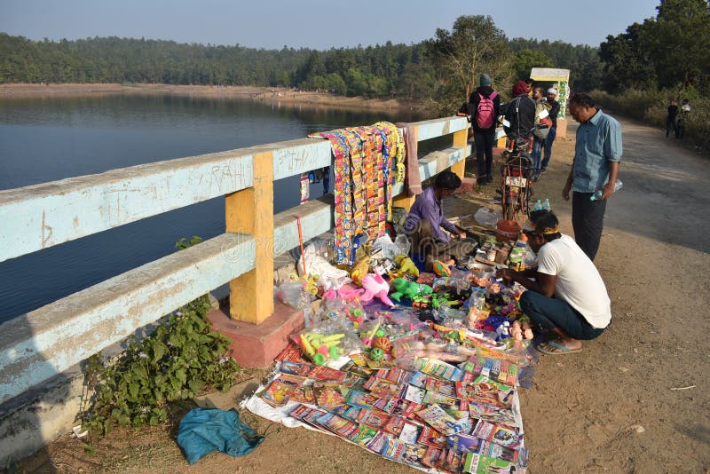 A Old Man Selling Playing Items Just beside a Lake Editorial Stock ...