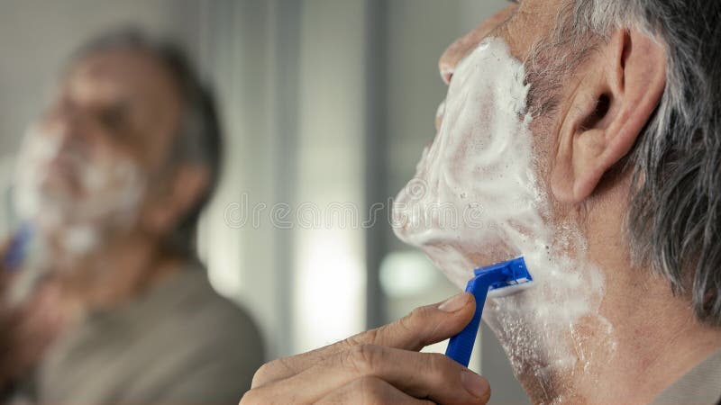 Old man shaves his beard stock photo. Image of cream - 258359034