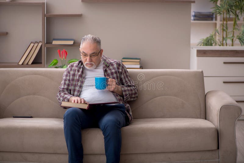 Old man sitting at home stock image. Image of telework - 287302013