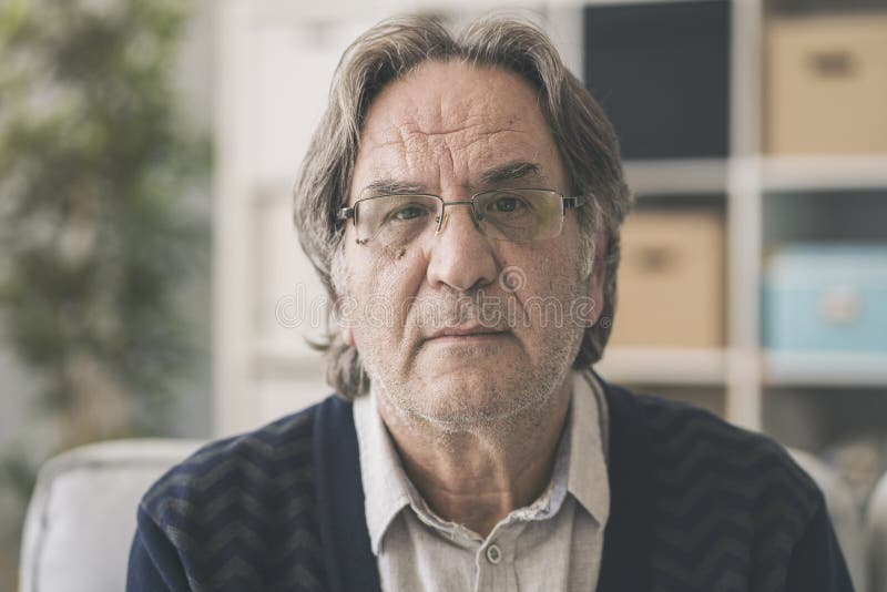 Old Man Sitting on Sofa and Looking at Camera Stock Image - Image of ...