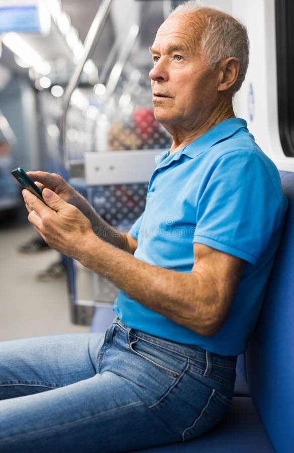 Old Man Sitting in Subway Car with Smartphone Stock Image - Image of ...