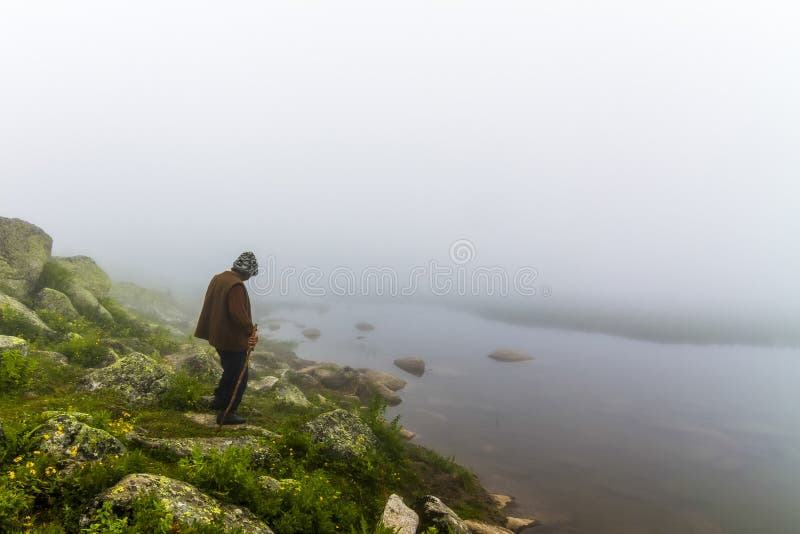 The Old Man Standing by the Lake in the Fog in Turkey Stock Photo ...