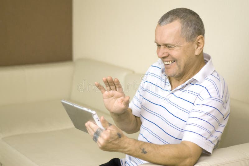 Old Man with Tattooed Hands Using Tablet PC Waving Hello Having Stock ...