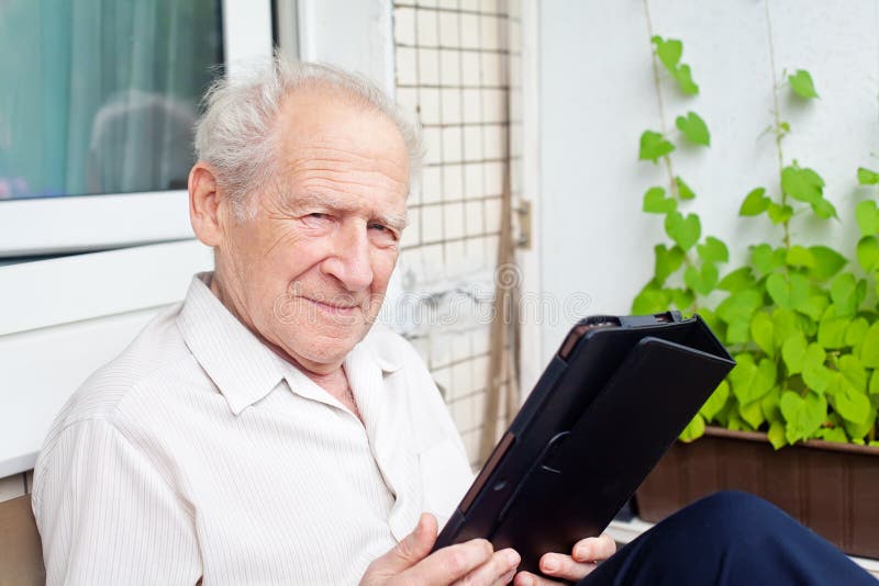 Old Man with a Touchpad PC stock image. Image of wrinkled - 33703631