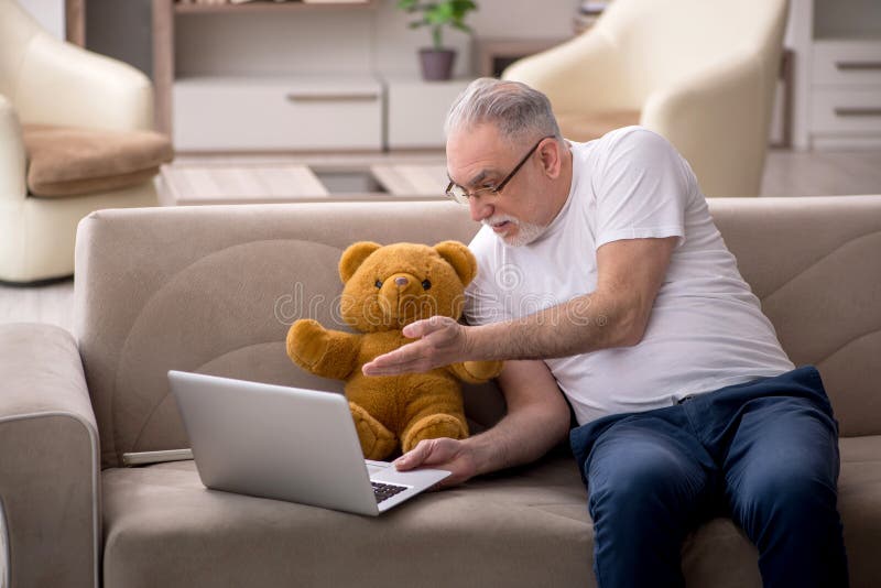 Old Man with Toy Bear at Home Stock Photo - Image of home, online ...