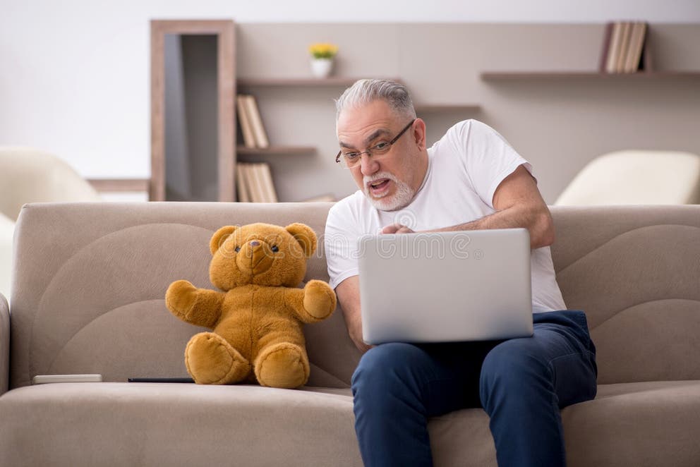 Old Man with Toy Bear at Home Stock Photo - Image of covid19, laptop ...
