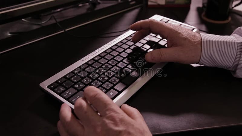 Old man typing on keyboard stock video. Video of buttons - 50751679