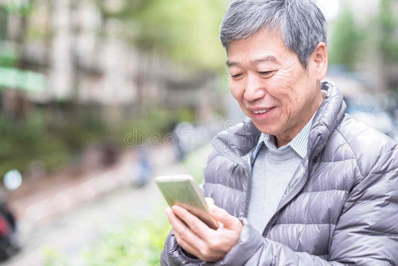 Old man use phone stock photo. Image of smartphone, green - 110589806
